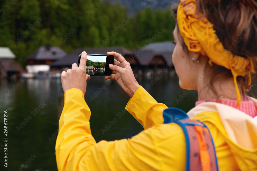 Modern smartphone device in travelers hands focus on screen with ...