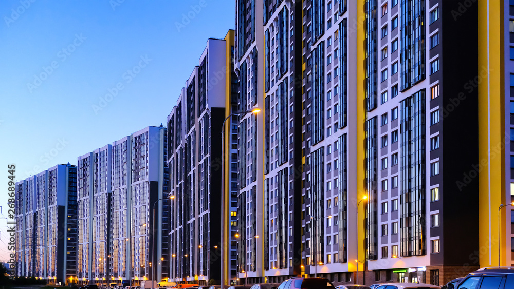 Evening time. Modern residential building in the light of twilight ...