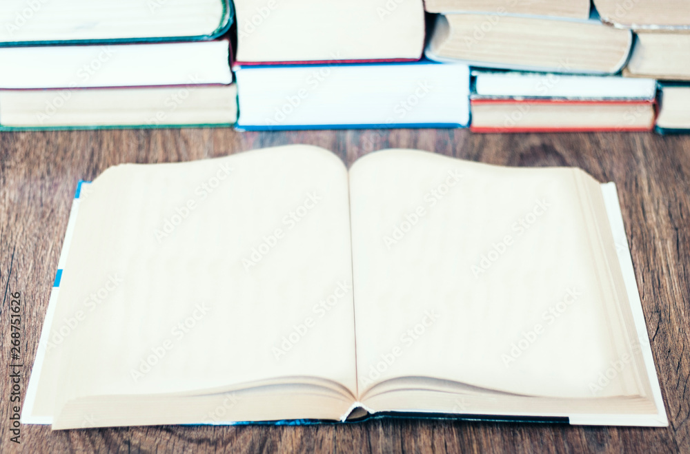 Open book with empty page and stack of old book education concept ...