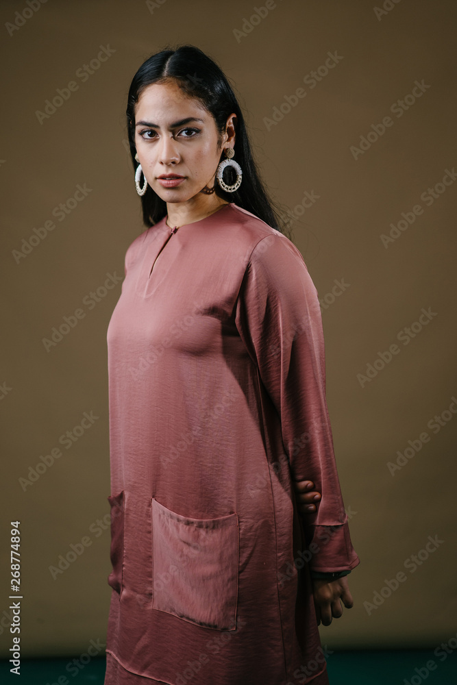 Portrait of a tall, slim and beautiful Middle Eastern Muslim woman in a ...