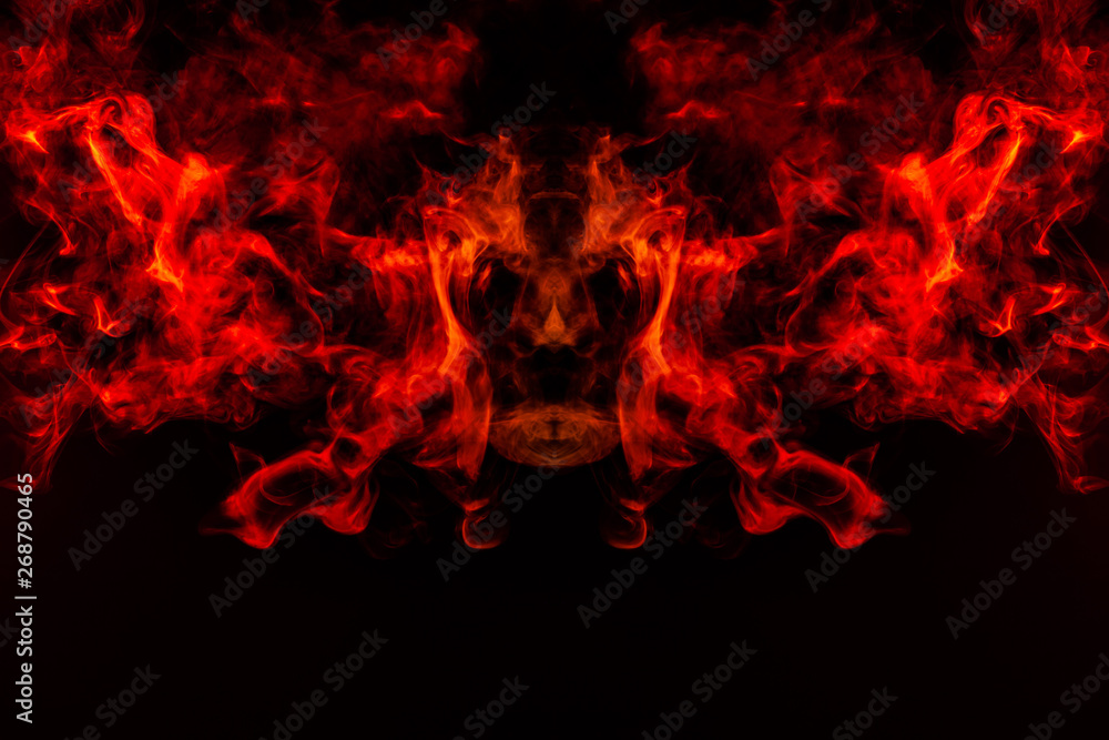 Smoke of different orange and red colors in the form of horror in the ...