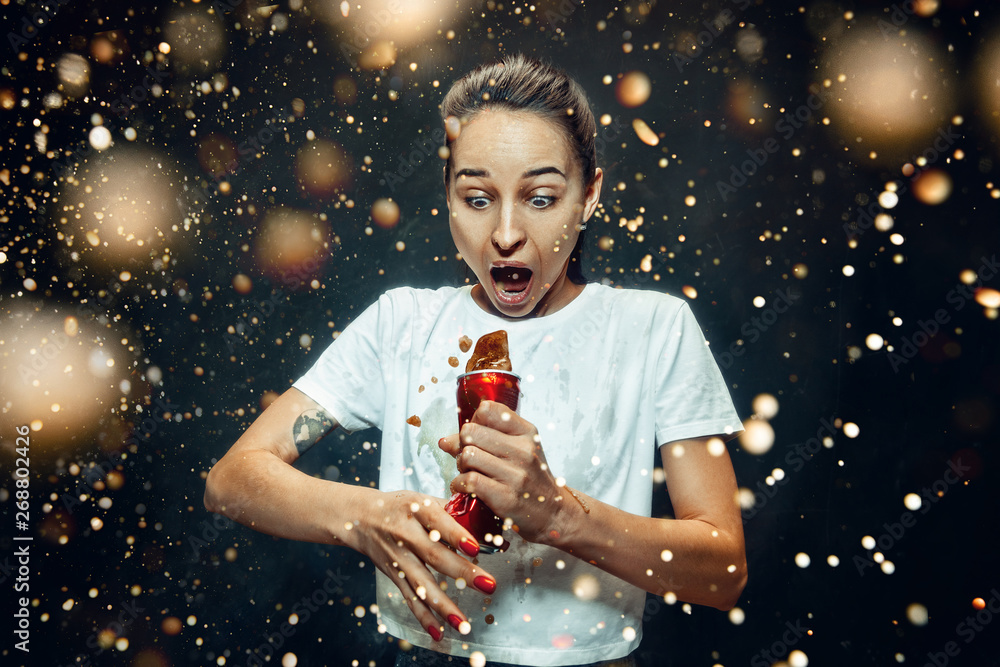 Zdjęcie Stock: Woman drinking a cola at studio. Young smiling happy ...