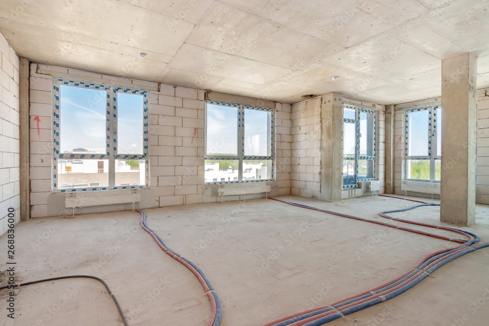 Construction site of residential apartment building interior in ...