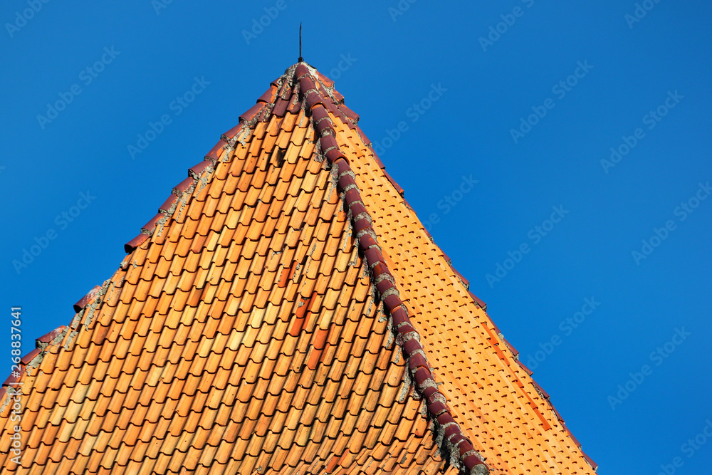 Red tiled pyramidal roof of a tower Stock Photo | Adobe Stock