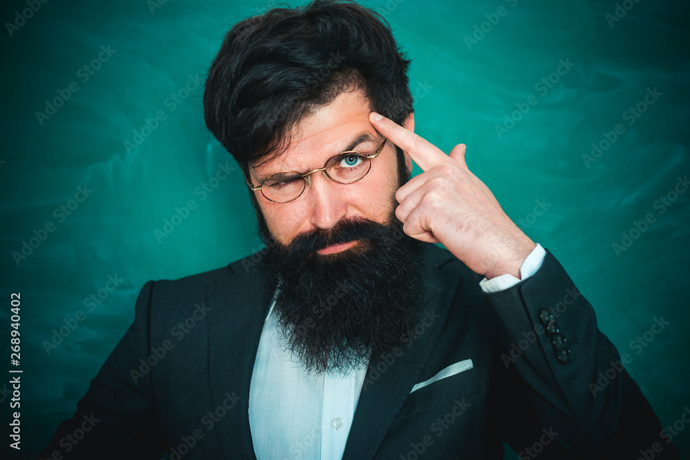 Professor in class on blackboard background. Young teacher near ...