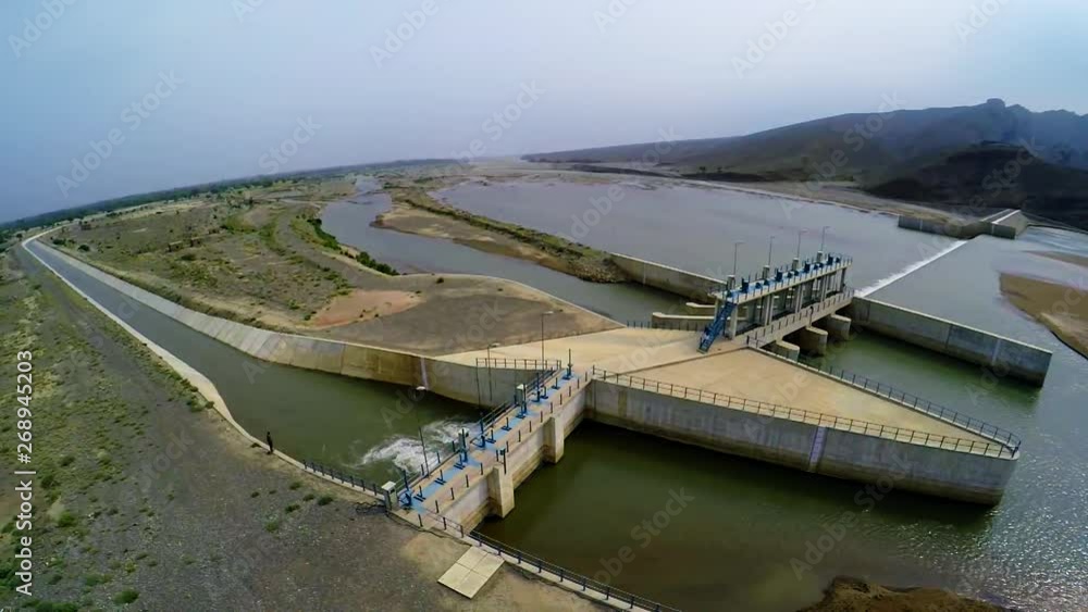 Top Aerial view of spillway of a dam, Beautiful majestic mountains in ...