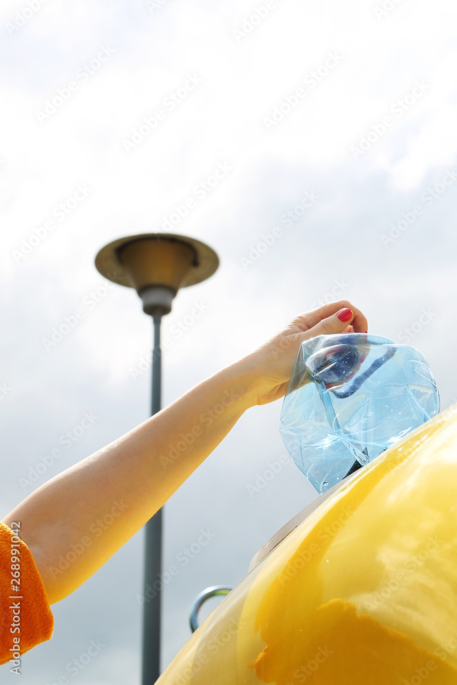 Sorting of waste, segregation of plastic waste into a container Stock ...