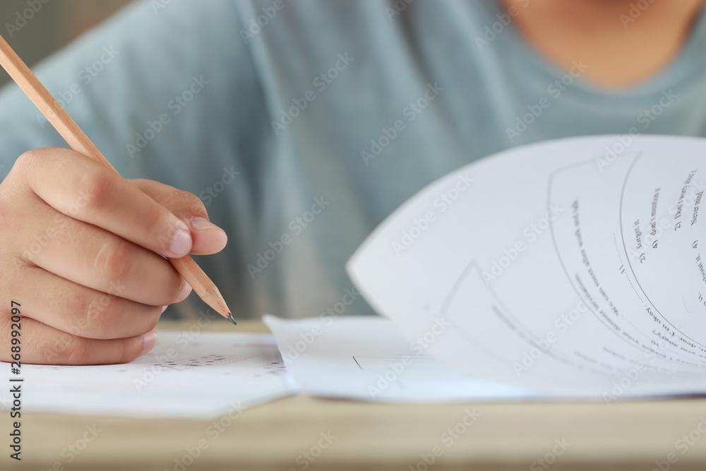 Student hand testing doing test exam with pencil drawing selected ...