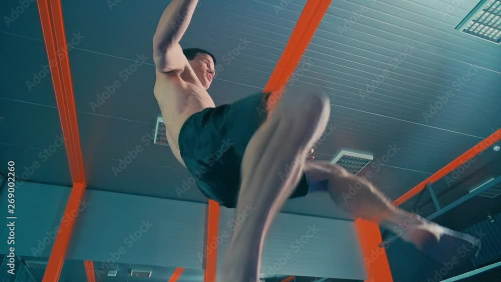 Fighter shows different combat movements and punches at the boxing ring ...