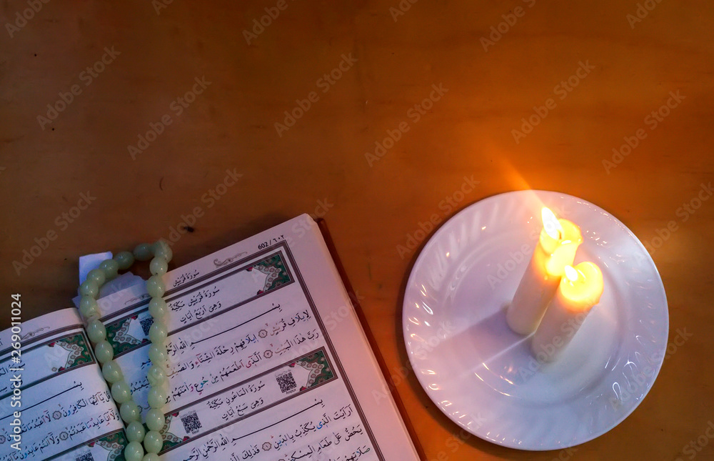 The Holy Quran and lights. Muslims holy book Koran. Open pages of the ...