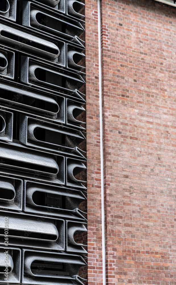 Combination of cast aluminium facade unit system in random modular clad ...