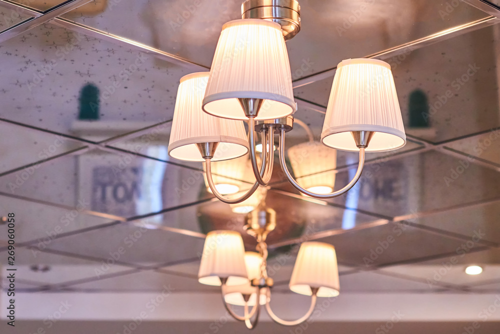 Mirror ceiling in the apartment. Reflection of the room in the mirrored ...