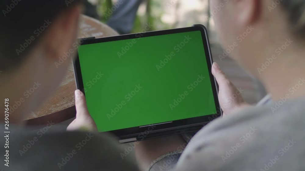 Mother and Son using digital tablet together, Green screen chroma key ...