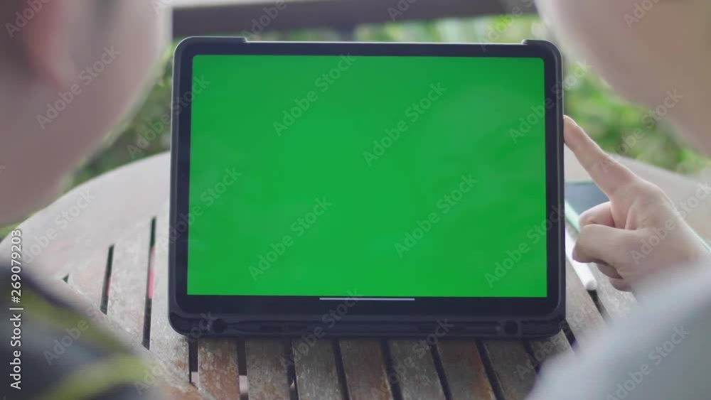 Mother and Son using digital tablet together, Green screen chroma key ...