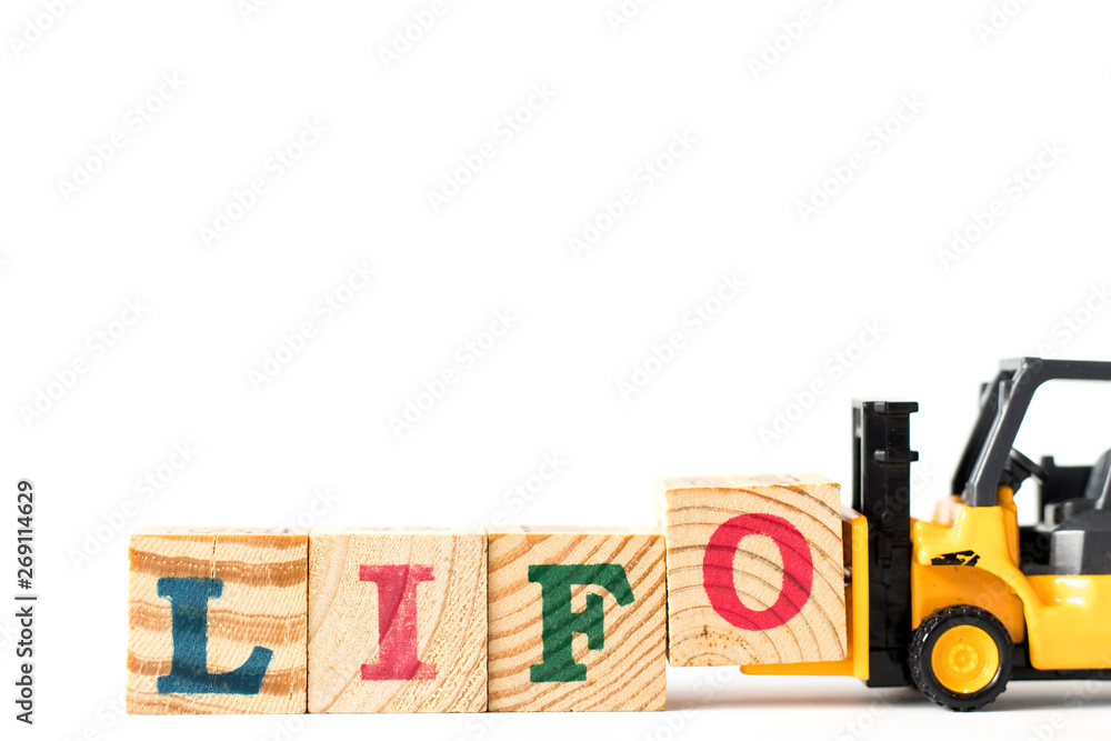 Toy forklift hold letter block o to complete word LIFO (Abbreviation of last in first out) on ...