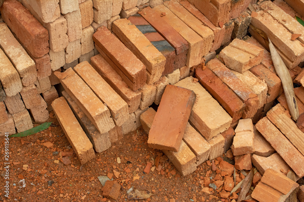 pile of bricks which is prepared for construction. red brick wall at ...