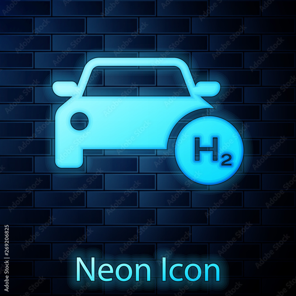 Glowing neon Hydrogen car icon isolated on brick wall background. H2 ...