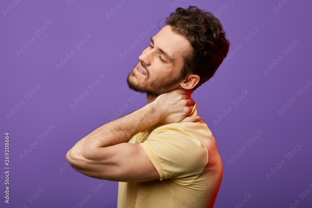 attractive man has pain in neck.how do you relieve spasms in neck ...