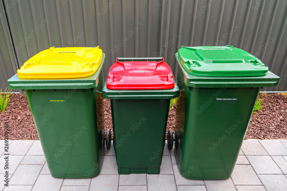 Australian home wheelie bins set on backyard Stock Photo | Adobe Stock