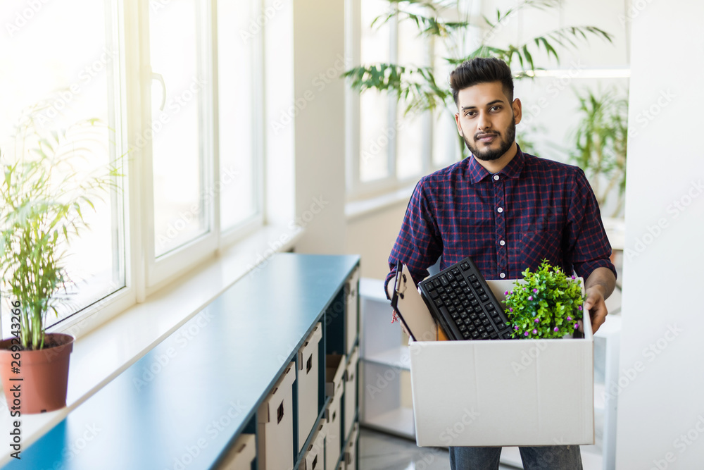 business, firing and job loss concept. Sad fired indian male office ...