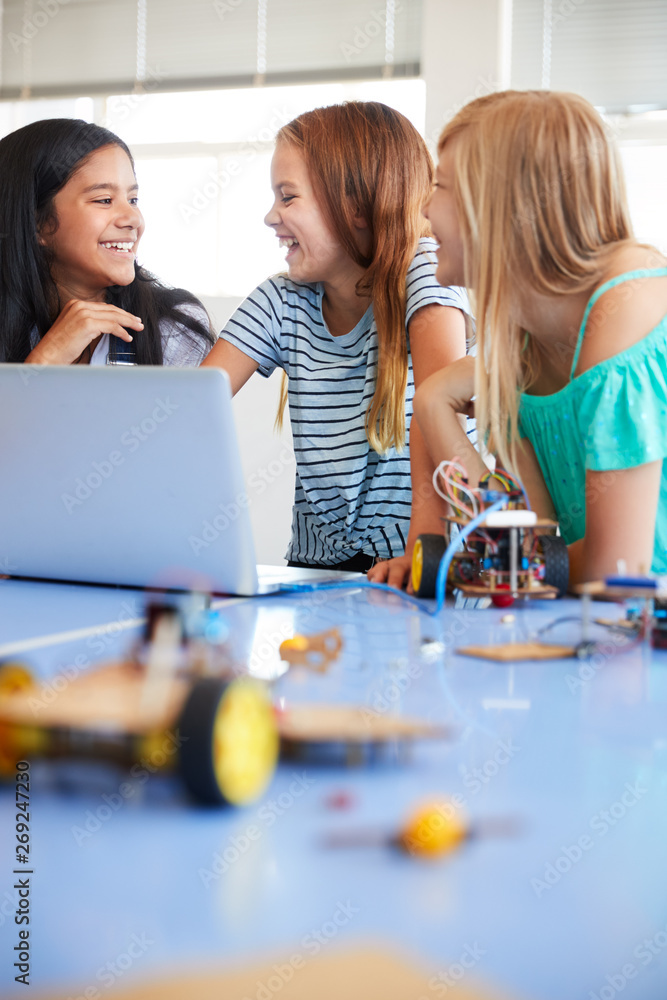 Foto de Three Female Students Building And Programing Robot Vehicle In ...