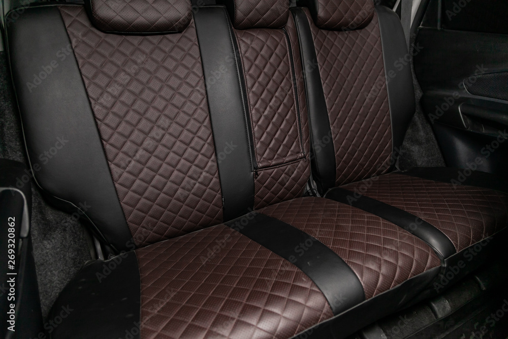 Сlose-up of the car black and brown interior: leather rear seats and ...