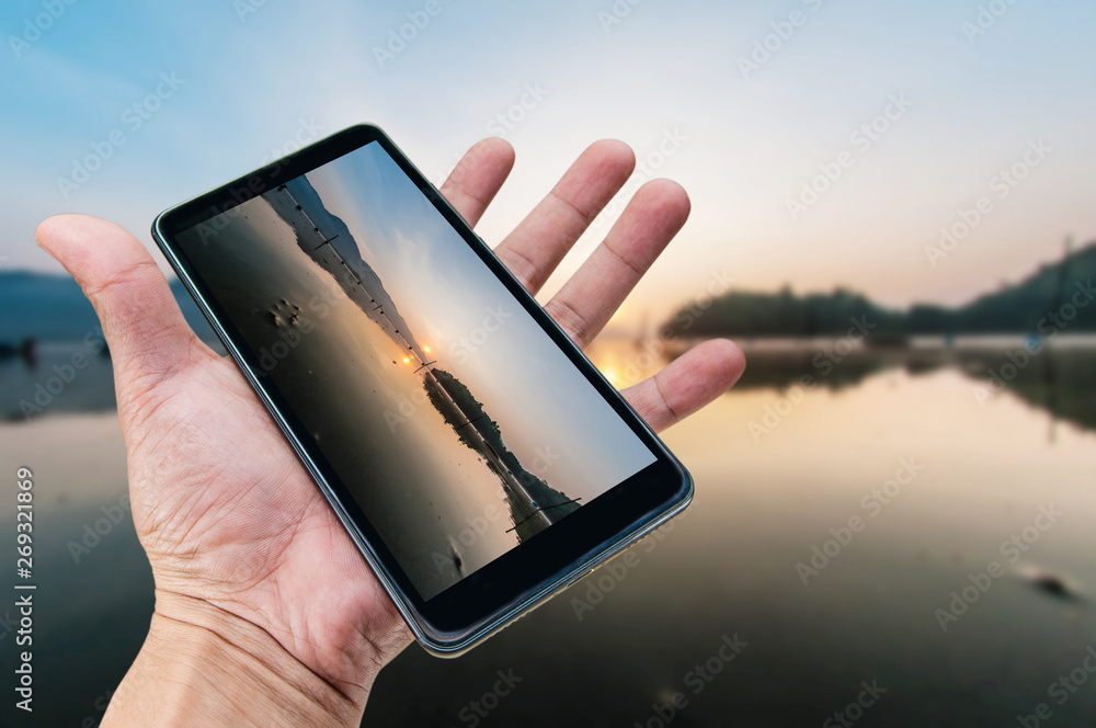 Hand holding smartphone landscape nature background Stock Photo | Adobe ...