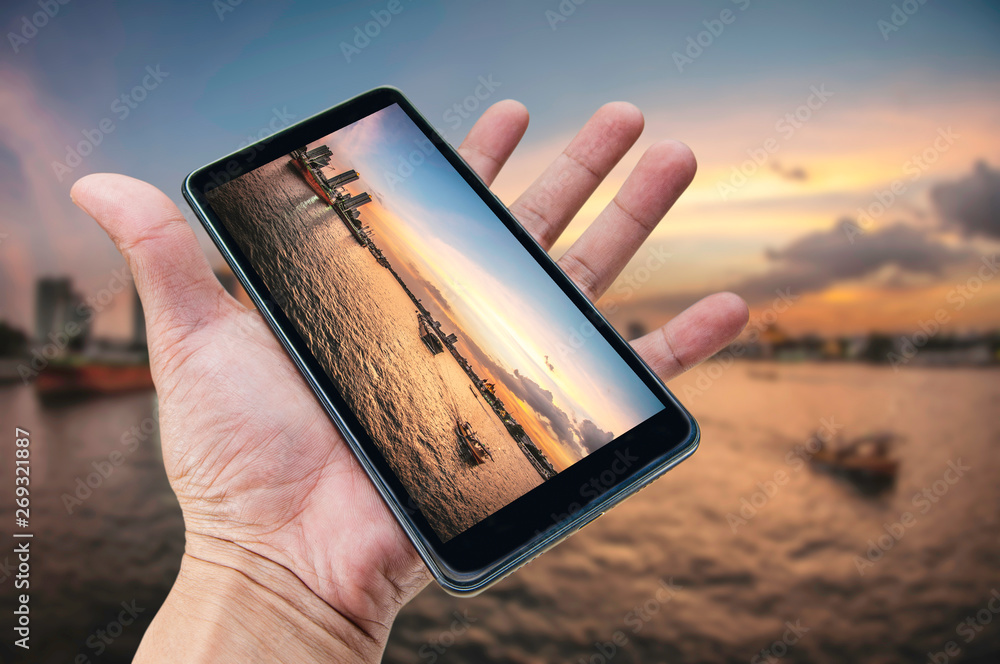 Hand holding smartphone landscape nature background Stock Photo | Adobe ...