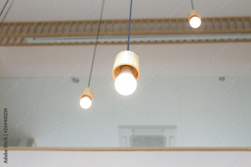 Round warm white LED bulb with wood texture socket lamp hanging from ...