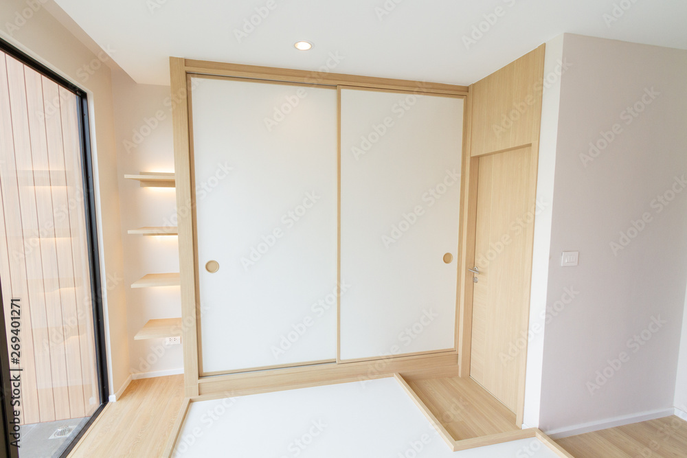 Large wardrobe Japanese-style white sliding door with a light brown ...