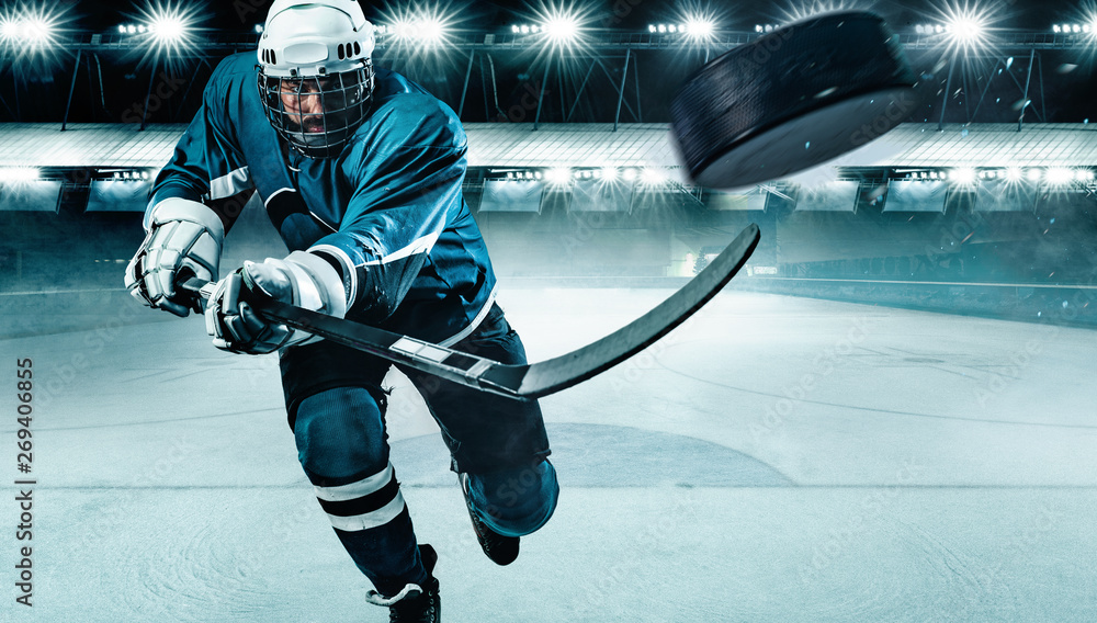 Ice Hockey player athlete in the helmet and gloves on stadium with ...