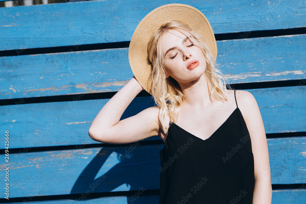 Stylish pretty girl with puffy lips and a penetrating gaze, in dark ...