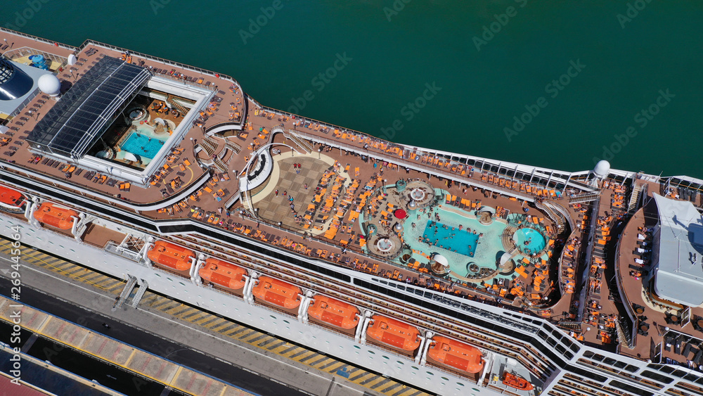 Aerial top view photo of crowded open sun deck with large pool and ...