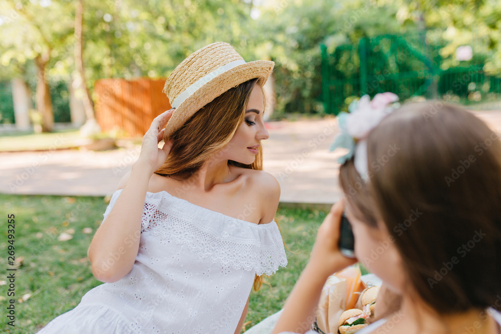 Graceful young woman in elegant vintage dress posing with eyes closed ...