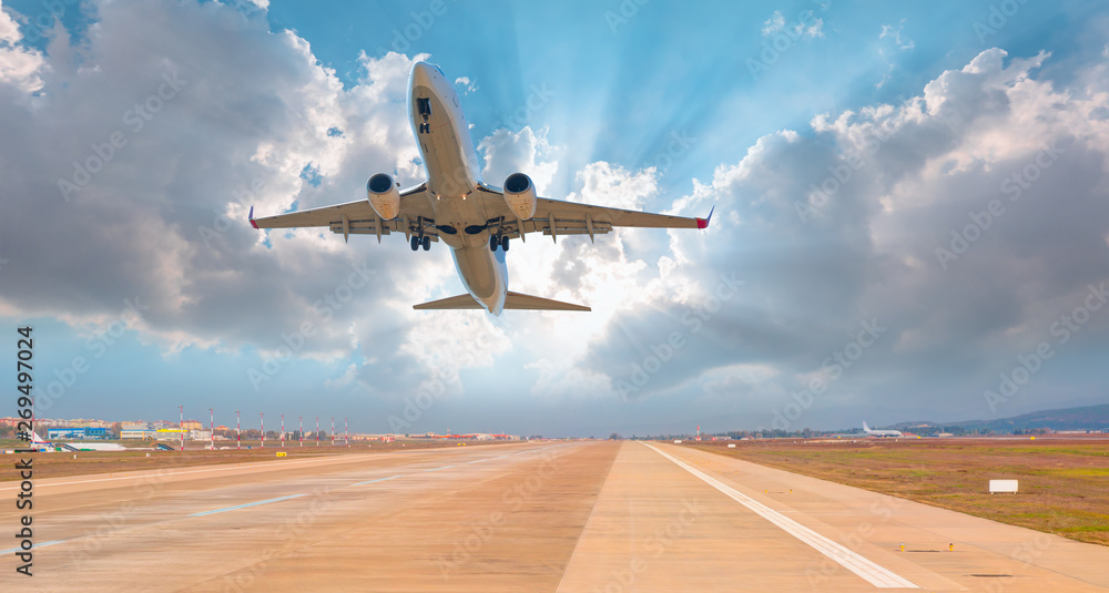 Airplane taking off from the airport Stock Photo | Adobe Stock