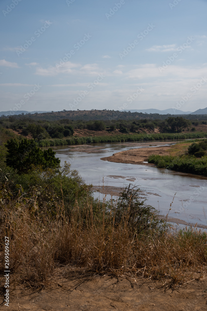 The Black Umfolozi River meandering through the African bush, South ...