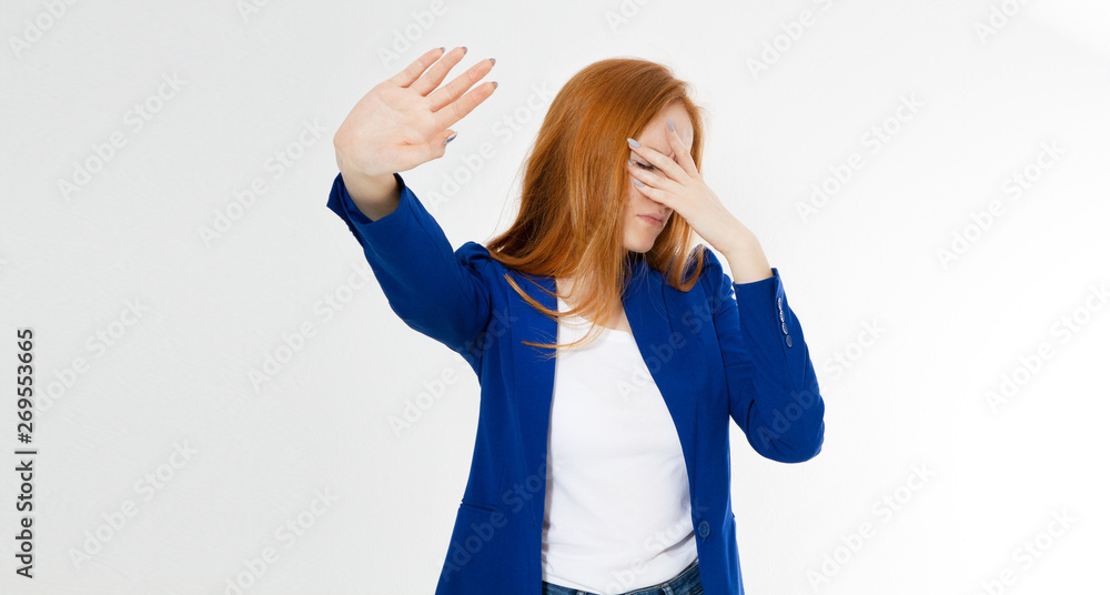Young red hair woman making a rejection pose and facepalm on a white ...