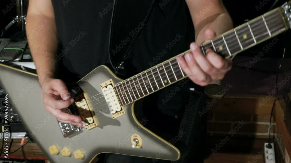 Lead guitarist in metal band. Guitar player performing on stage. Music ...