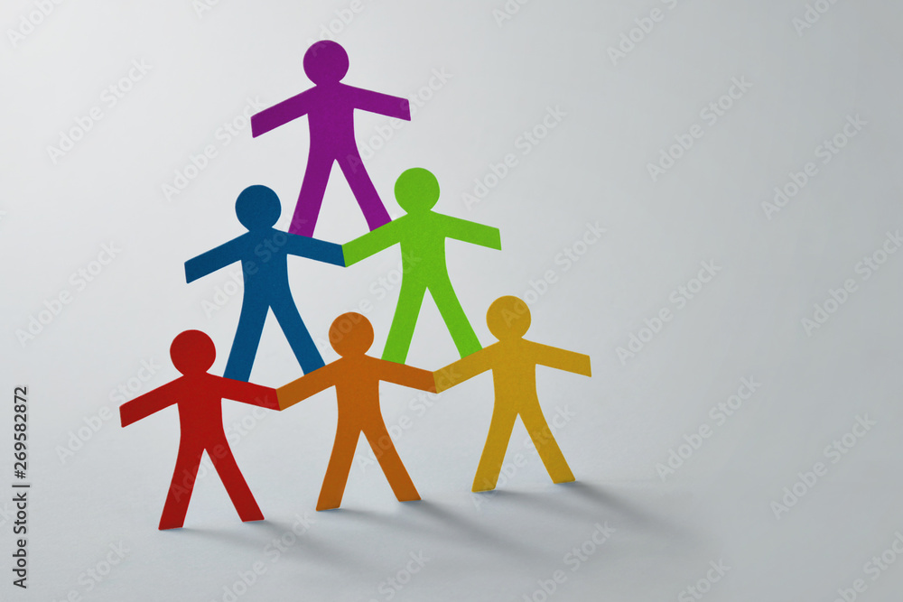 Human pyramid of colorful paper cut-out people on white background ...