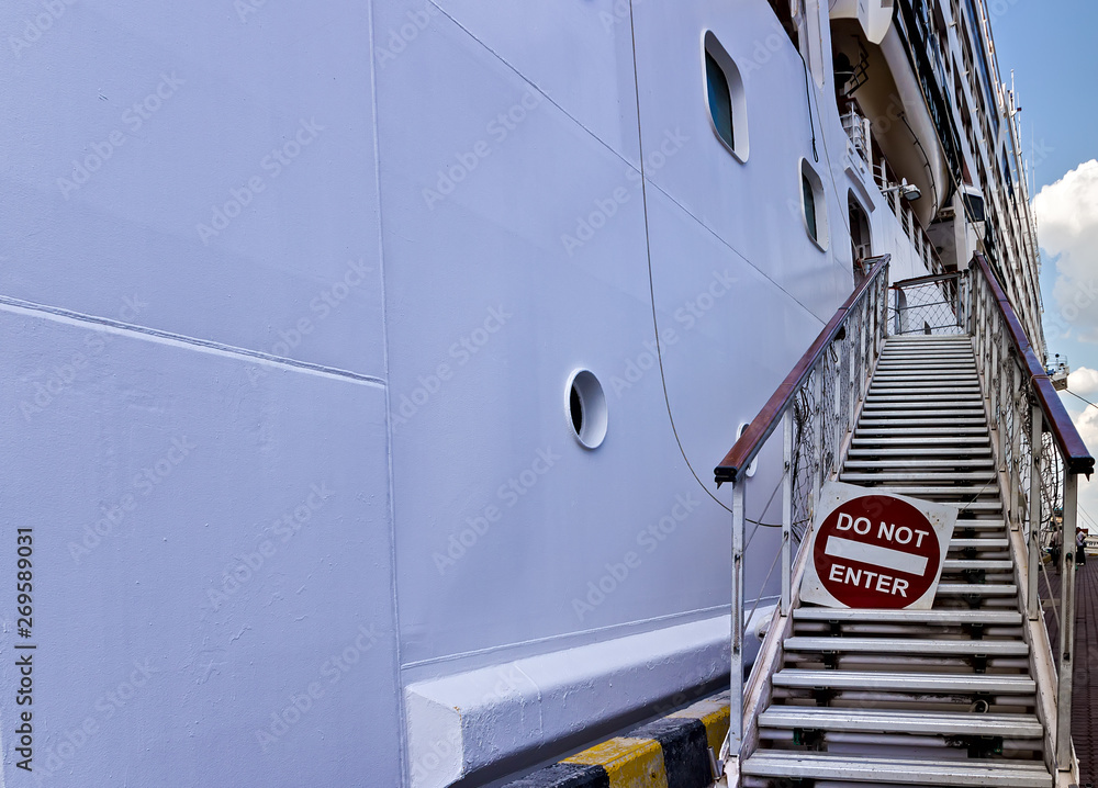 Sign"Do Not Enter" walkway entry open cruise ship near the pier gangway ...
