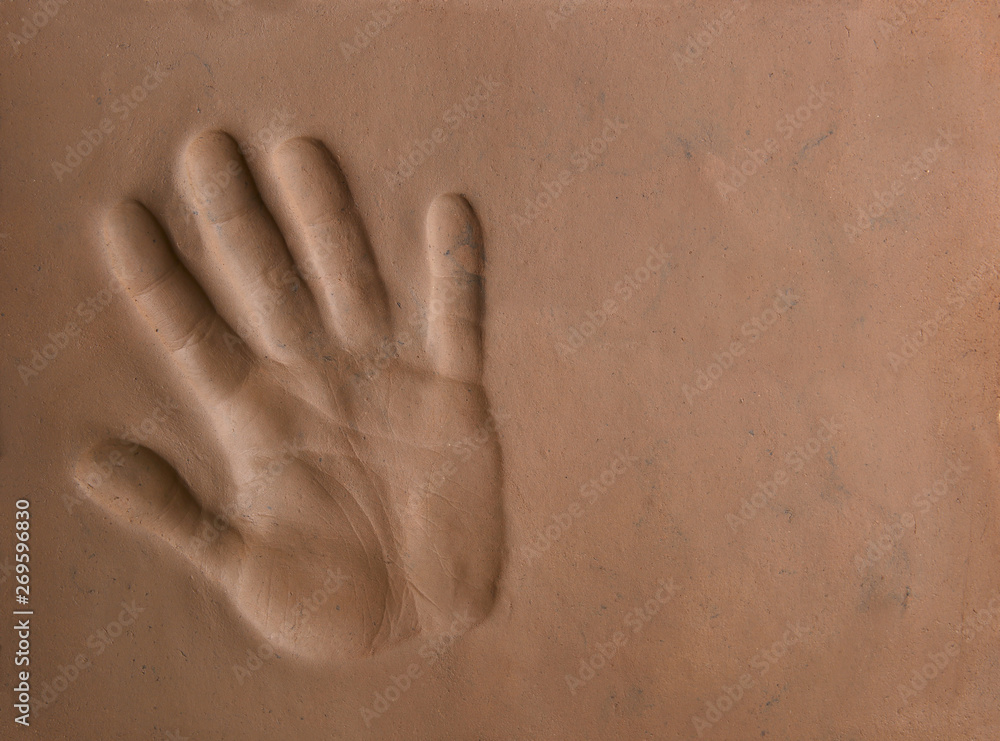 Hand print silhouette in clay soil. Hand print pattern in natural clay ...