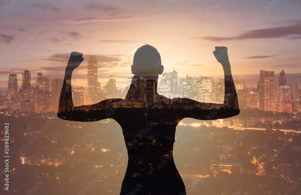 silhouette of strong victorious woman on city background Stock Photo ...
