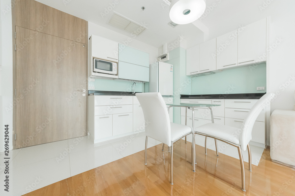 Kitchen interior with timber benchtop, decor and tiled splashback ...