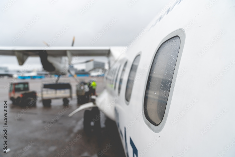 airplane window from the outside at the airport Stock Photo | Adobe Stock