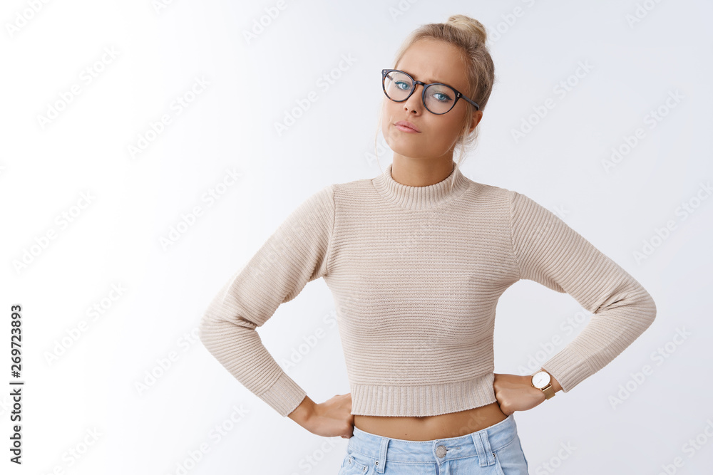 Explain yourself. Portrait of moody disappointed cute young woman in ...