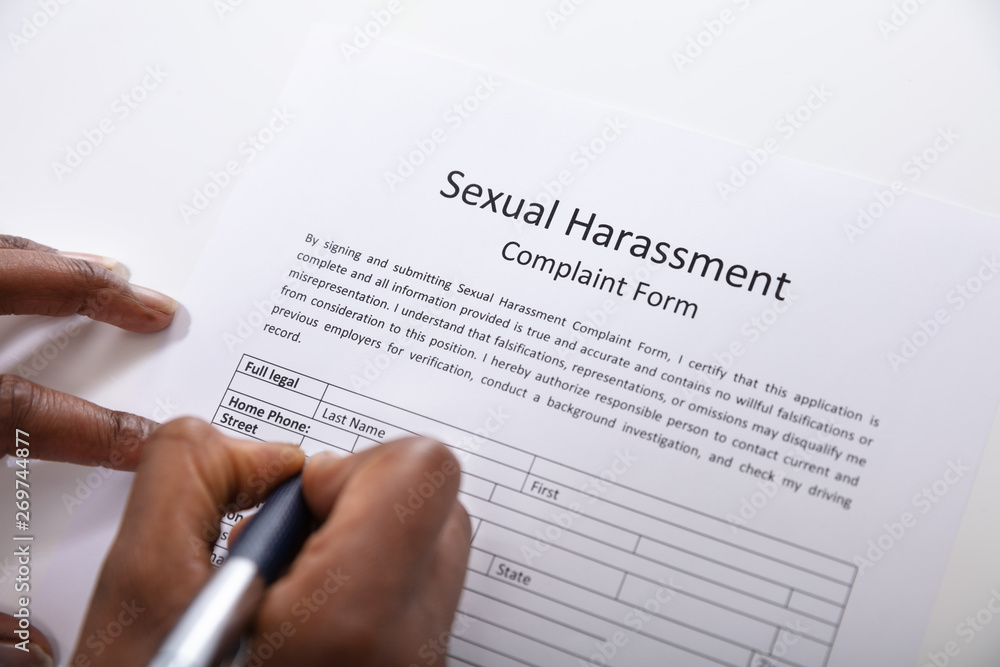 Human Hand Filling Sexual Harassment Complaint Form With Pen Stock ...