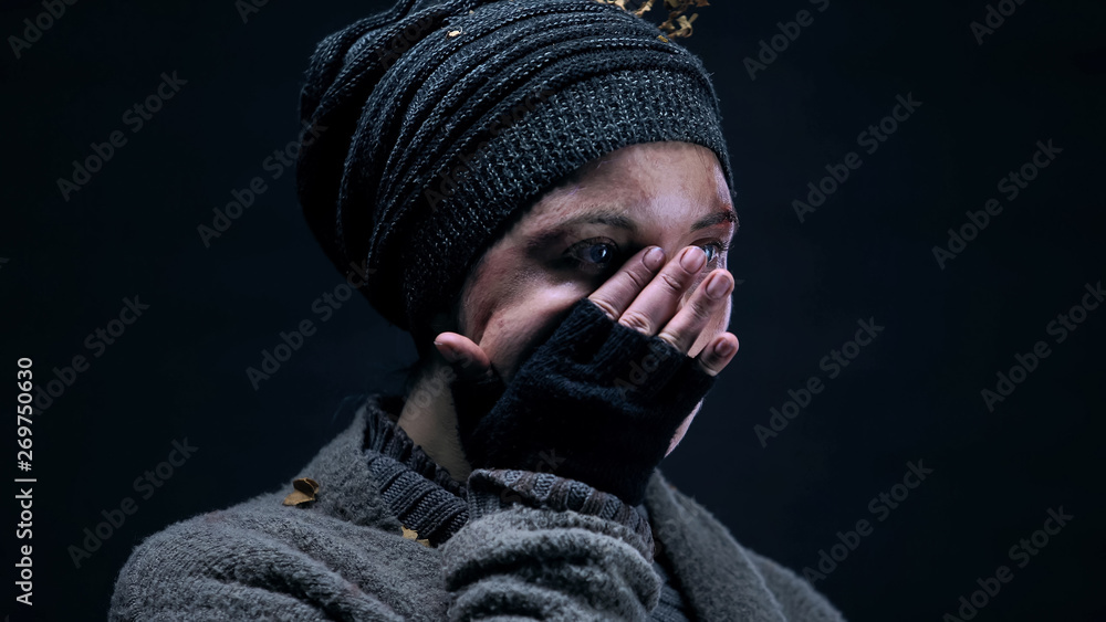 Female bum wiping tears covering face with hand, poverty hopelessness ...