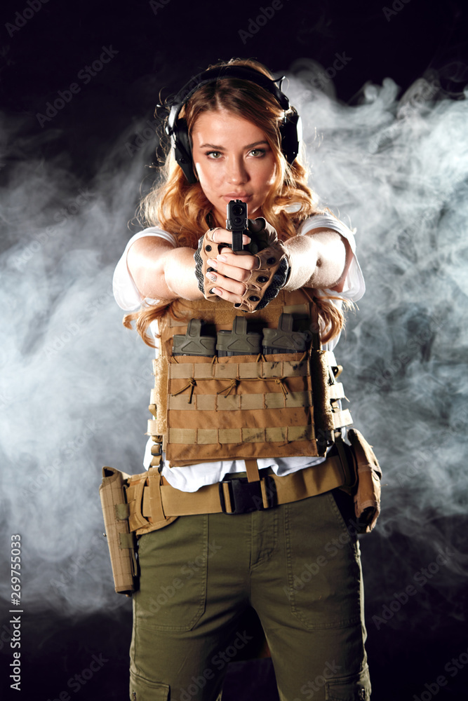 Calm and concentrated woman soldier possessing such features as stress ...