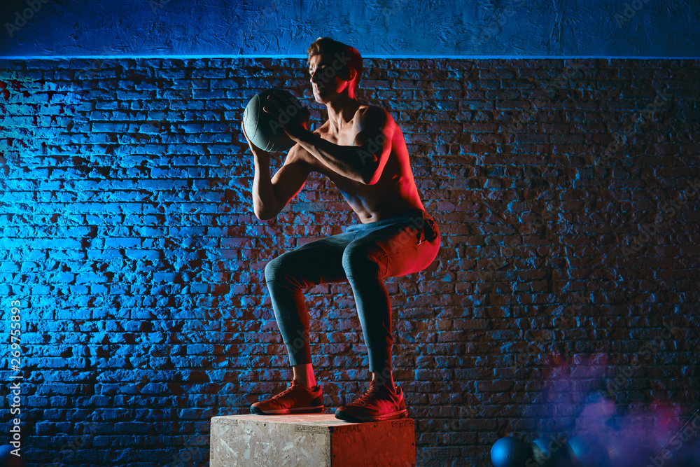 Handsome caucasian competitive mamber perfecting his Box Jumps adding ...