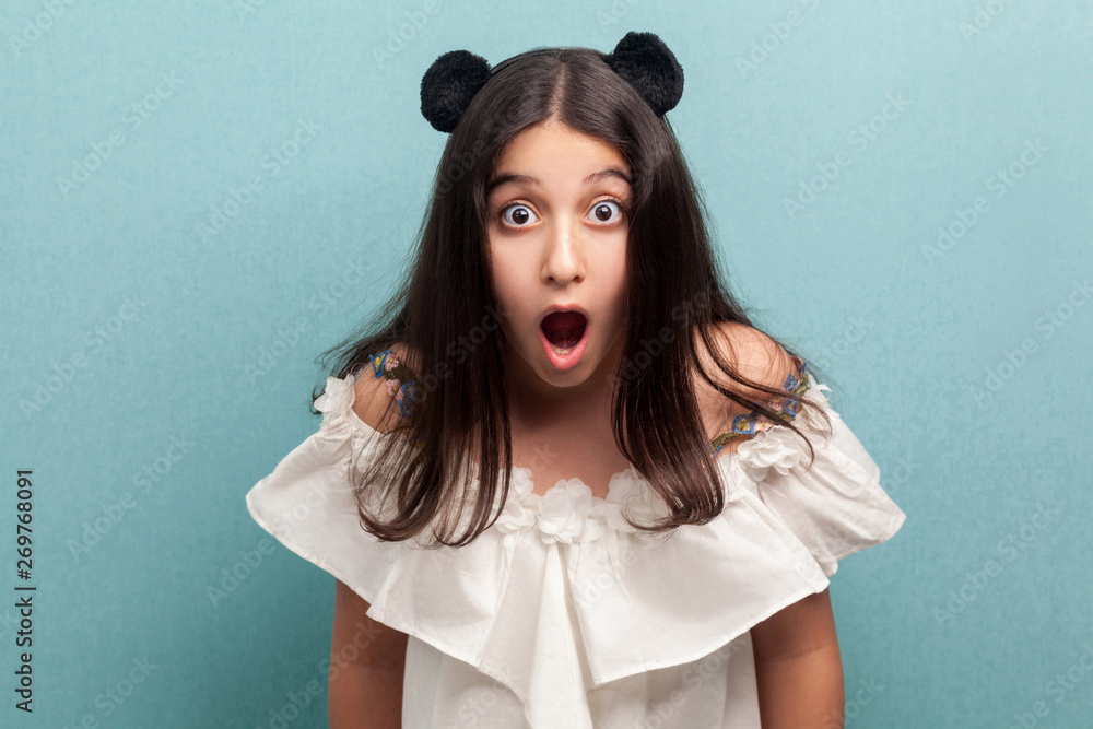 Portrait of shocked beautiful brunette young girl with black long ...